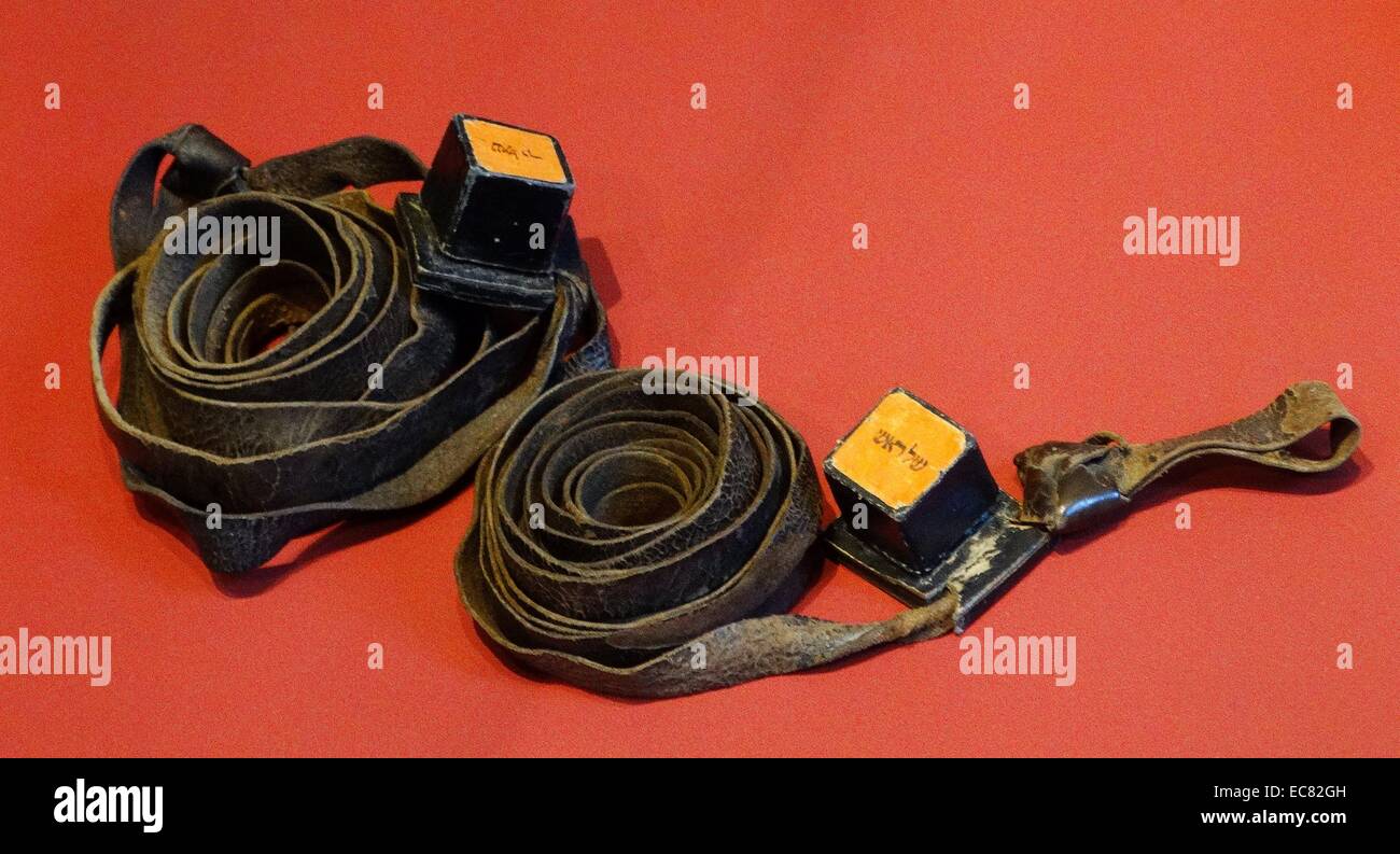 The leather boxes of the phylacteries (tefillin) that are bound on the ...