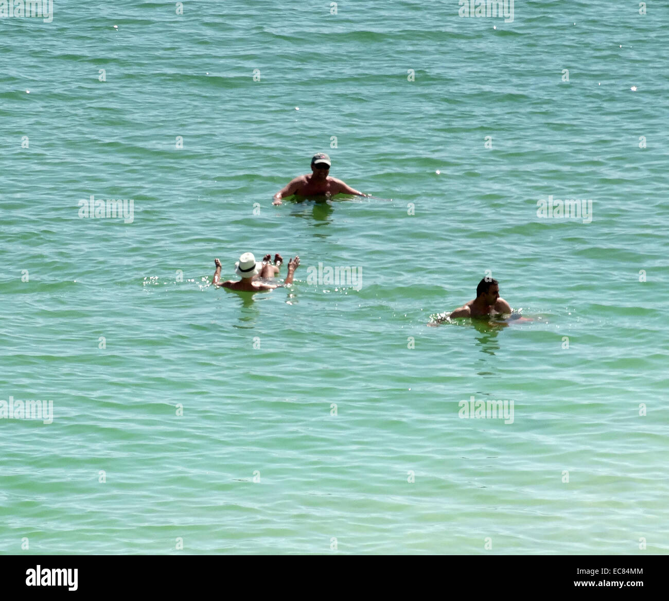 Bathers float on the Dead Sea. The Dead Sea is popular with tourists ...