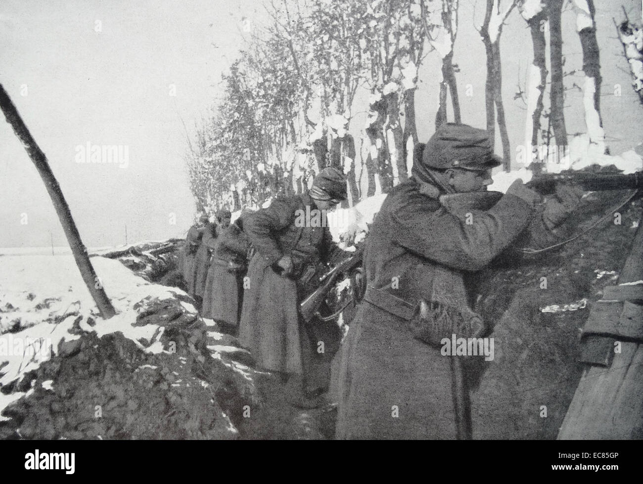 Photograph of French reserve soldiers in a trench near Calais firing on ...