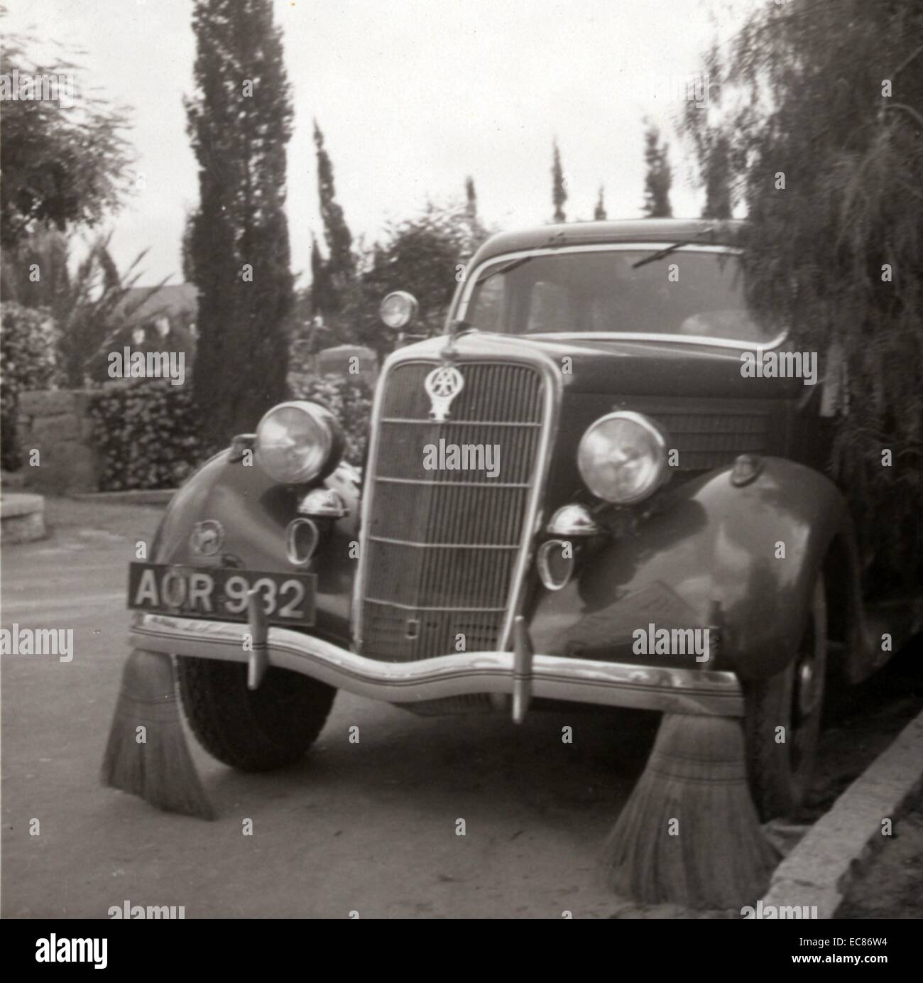 Photograph of a motor car with brooms to sweep away tracks thrown by ...