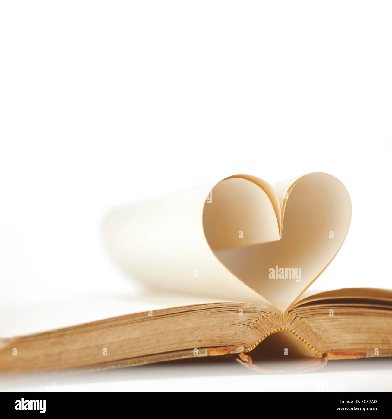 Heart made of blank pages inside a book on glitter background Stock ...