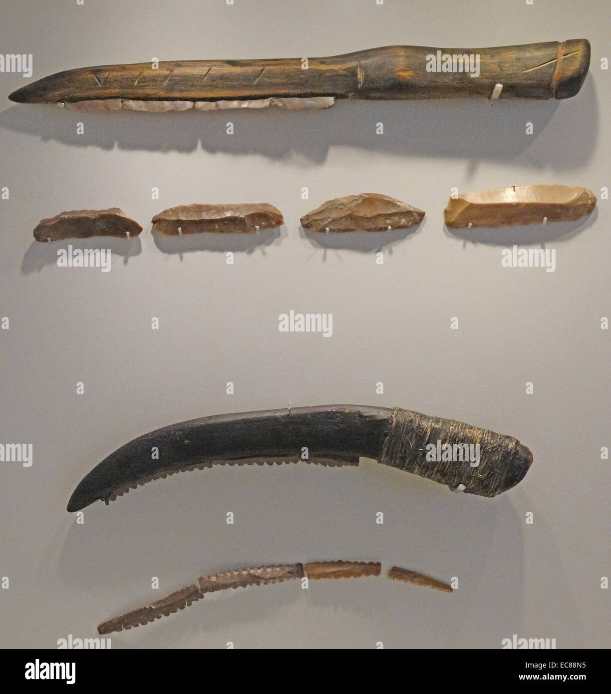 Collection of agricultural tools featuring sickles, sickle blades, axes ...