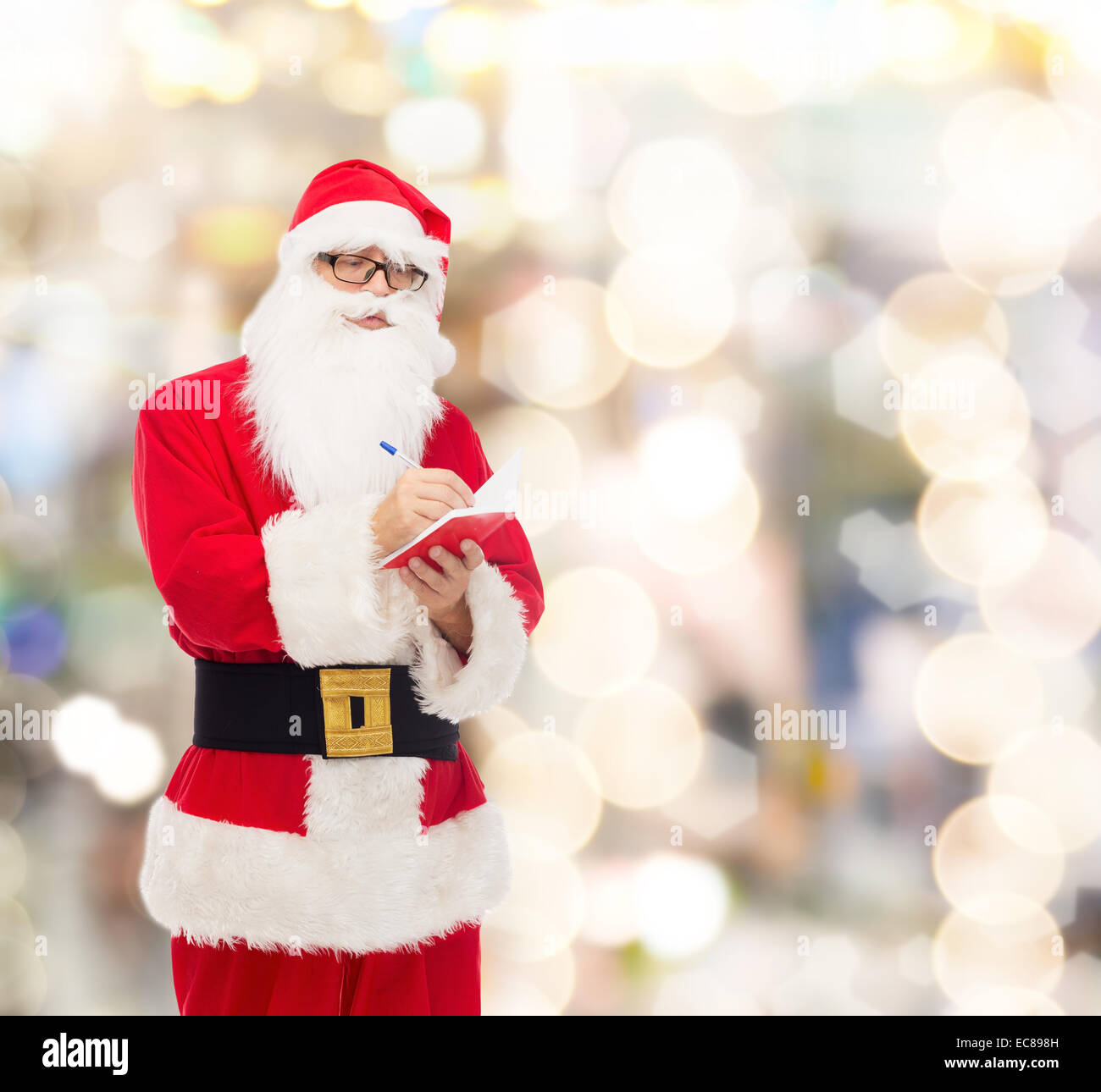 man in costume of santa claus with notepad Stock Photo - Alamy