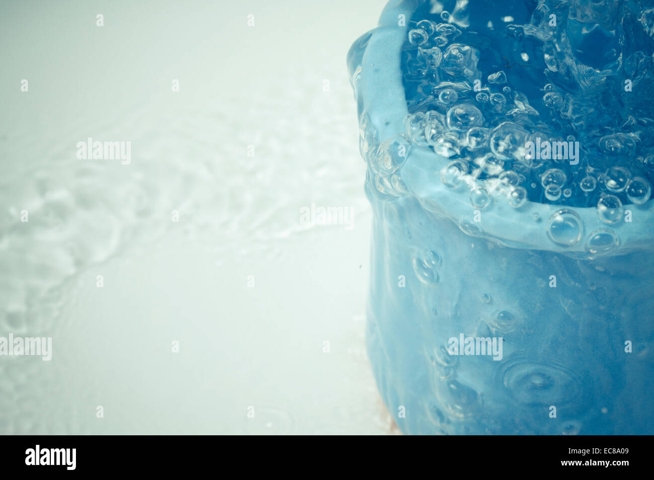 cup container pot water splashing movement Stock Photo - Alamy