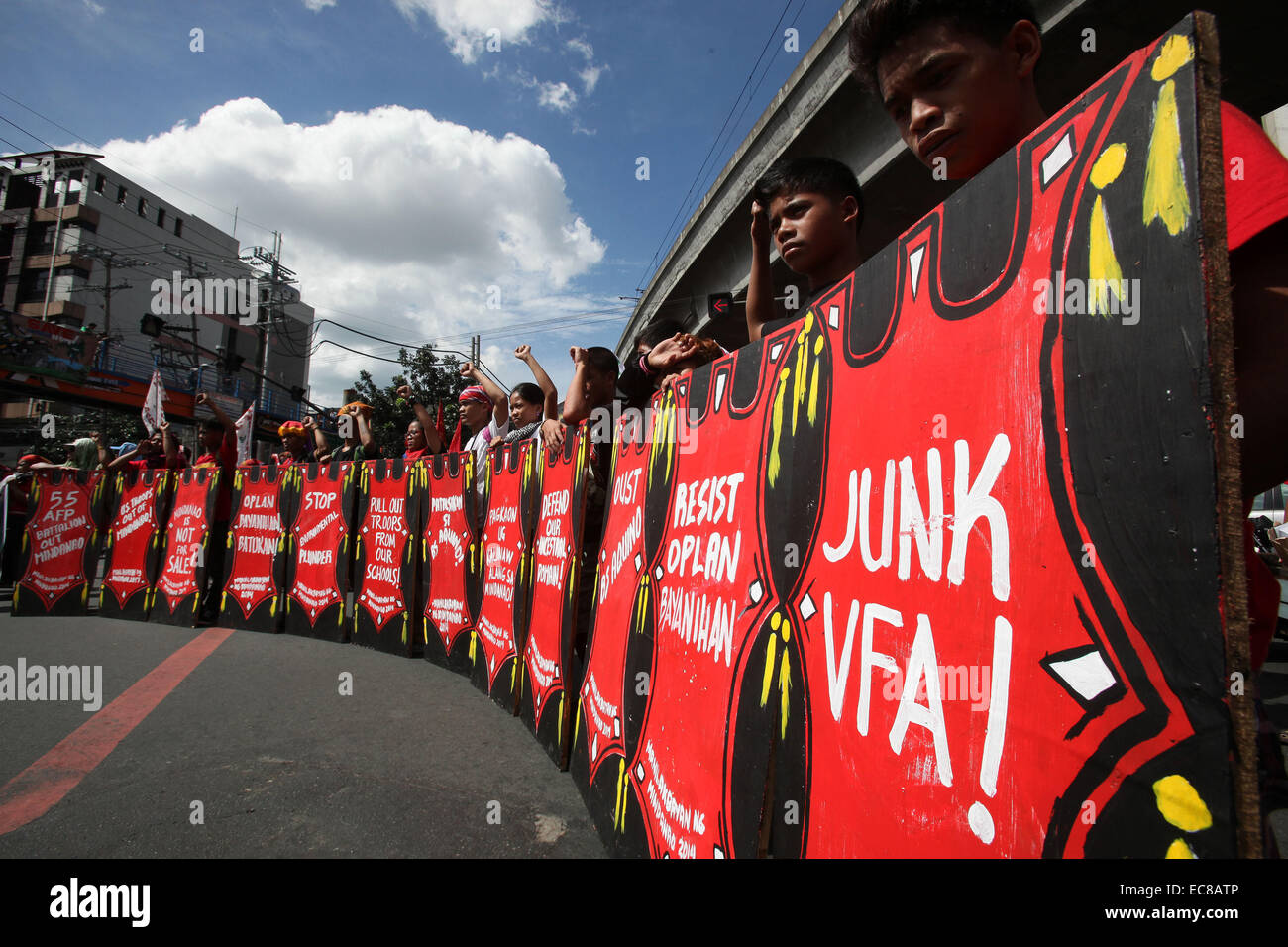 Manila, Philippines. 10th Dec, 2014. Activists hold placards during a ...