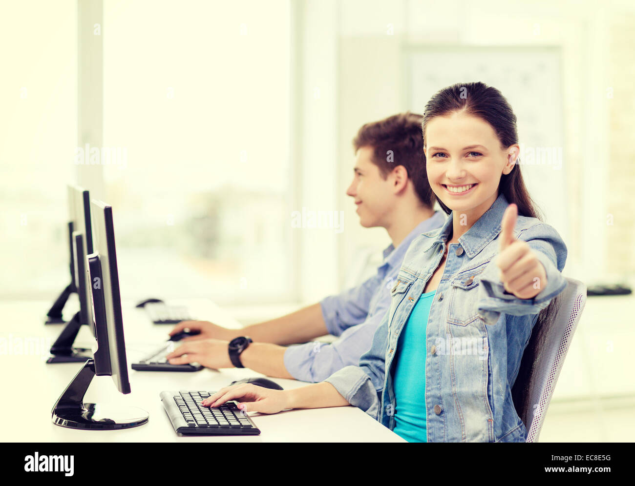 two smiling students in computer class Stock Photo - Alamy