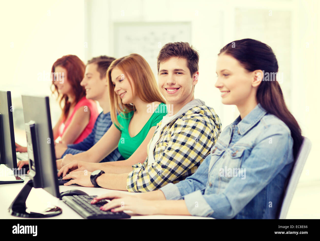 smiling student with computer studying at school Stock Photo - Alamy