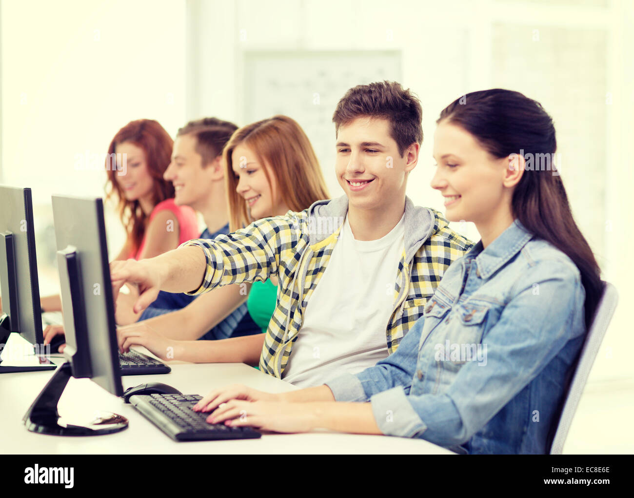 female student with classmates in computer class Stock Photo - Alamy