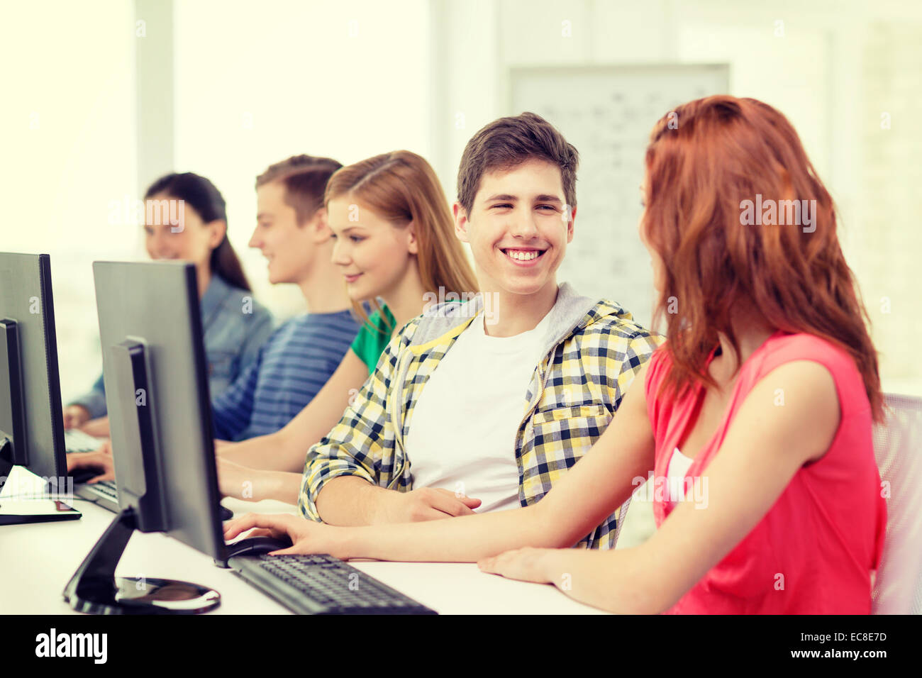 smiling students in computer class at school Stock Photo - Alamy