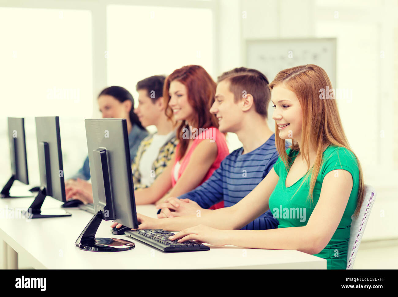 female student with classmates in computer class Stock Photo - Alamy