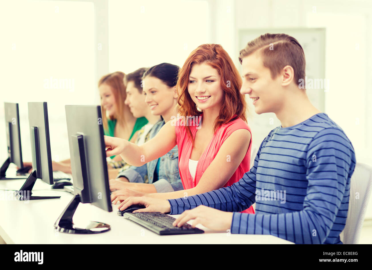 female student with classmates in computer class Stock Photo - Alamy
