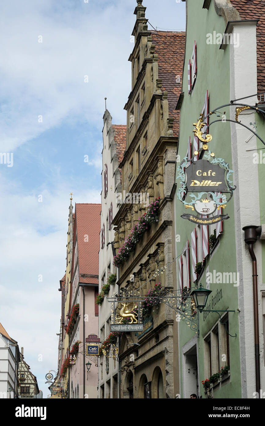 Various hanging signs in Rothenburg Stock Photo - Alamy