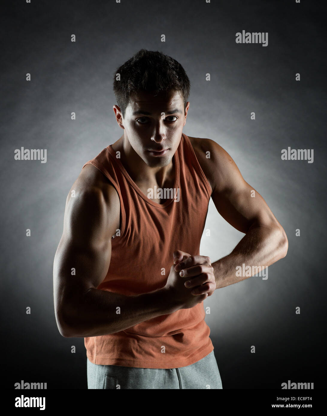 young man showing biceps Stock Photo - Alamy