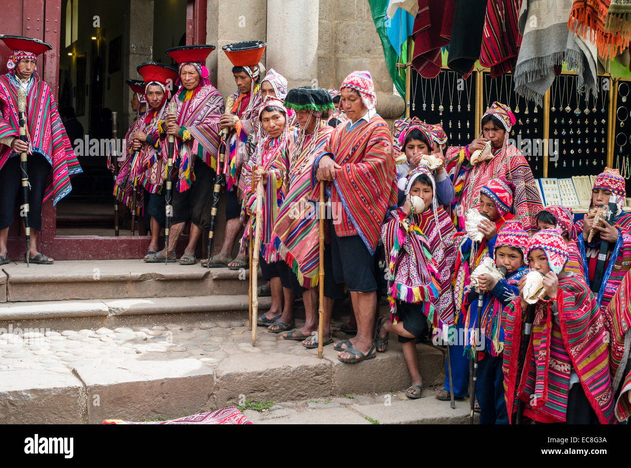 Young Quechua boys blow conch shells during a traditional Mass at the ...