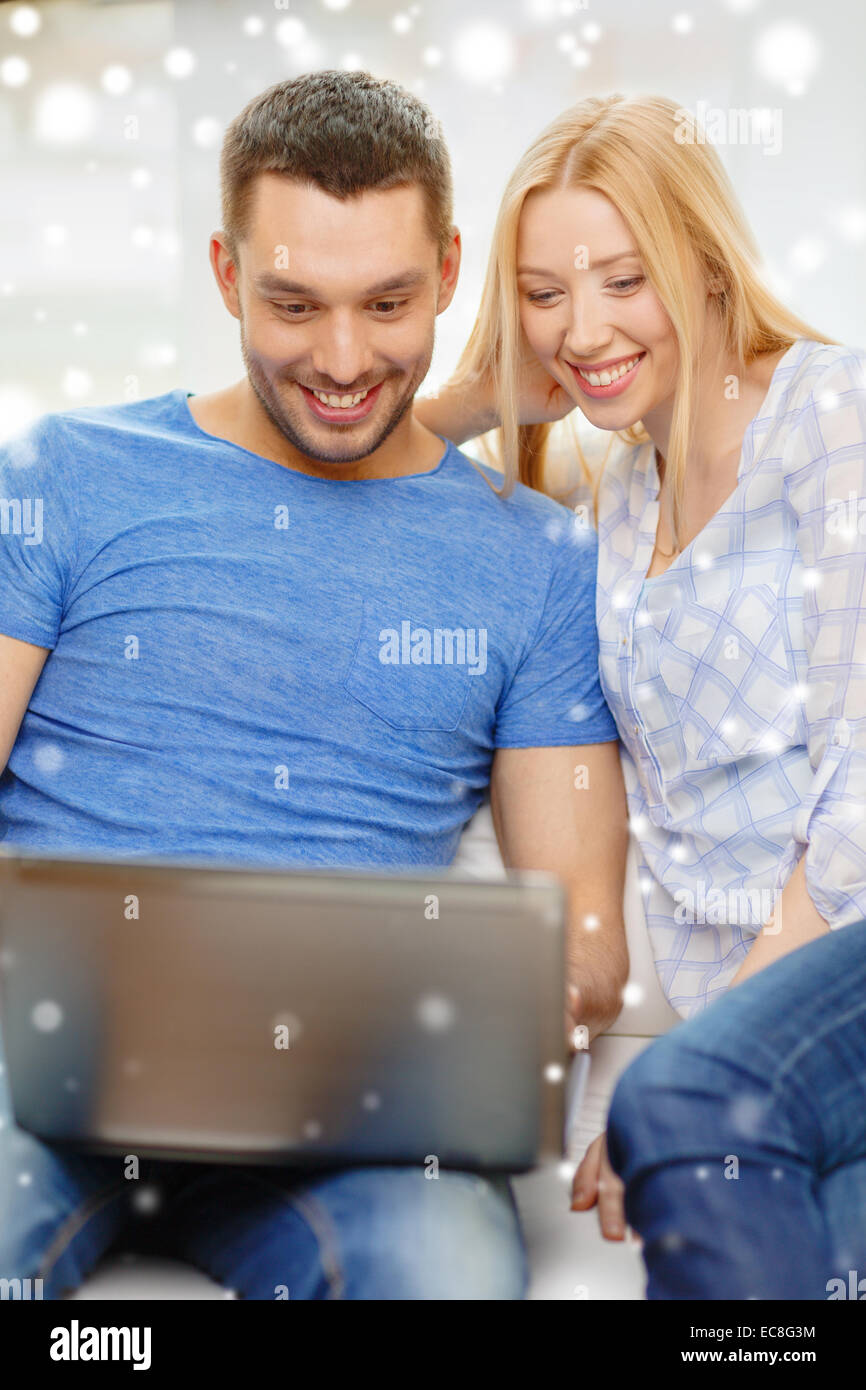 smiling happy couple with laptop at home Stock Photo - Alamy