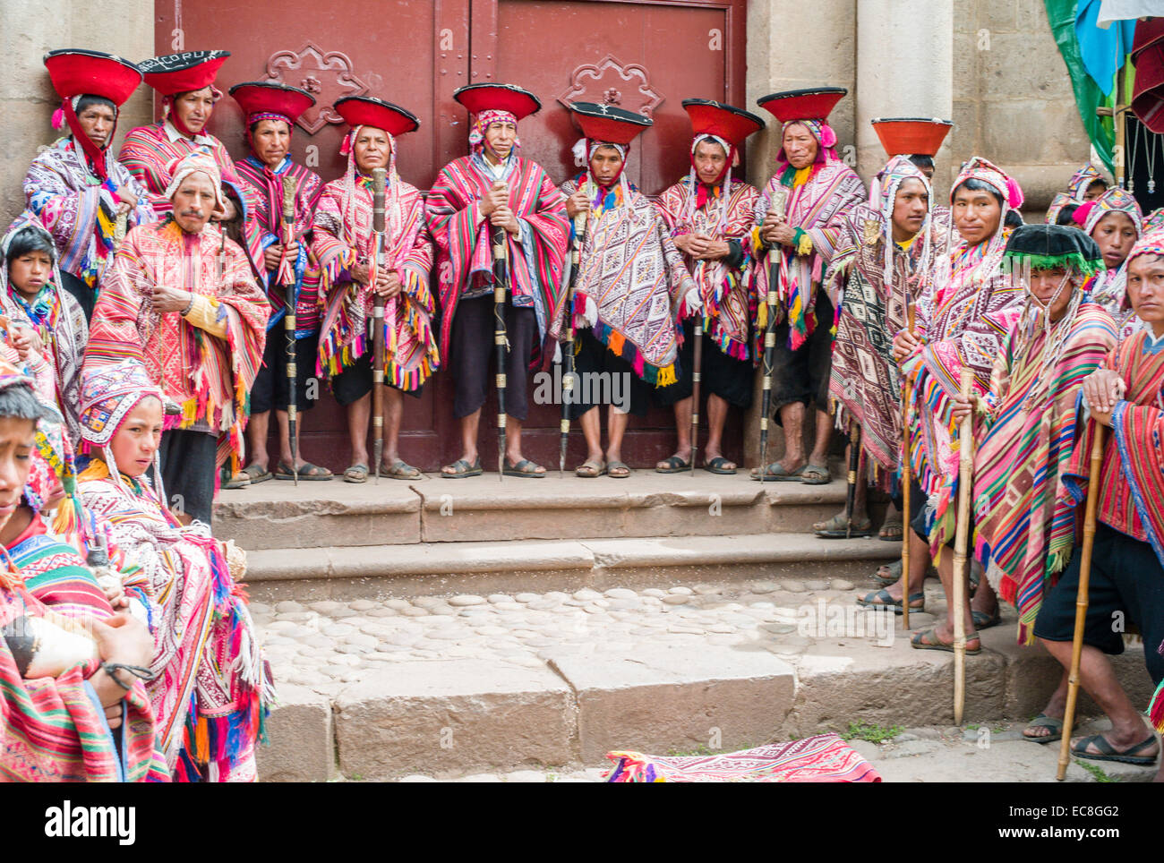 Traditionally dressed Quechua men celebrate Mass and the Catholic ...