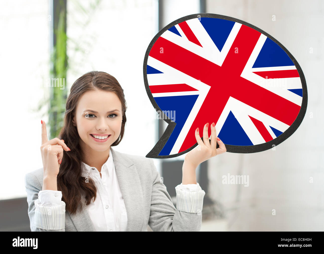 smiling woman with text bubble of british flag Stock Photo - Alamy