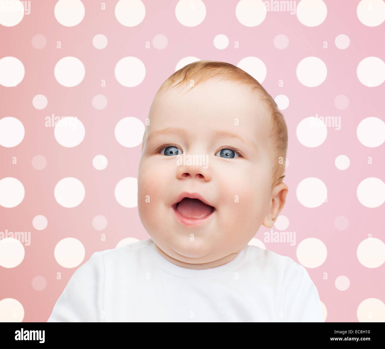 smiling baby girl face over pink polka dots Stock Photo - Alamy