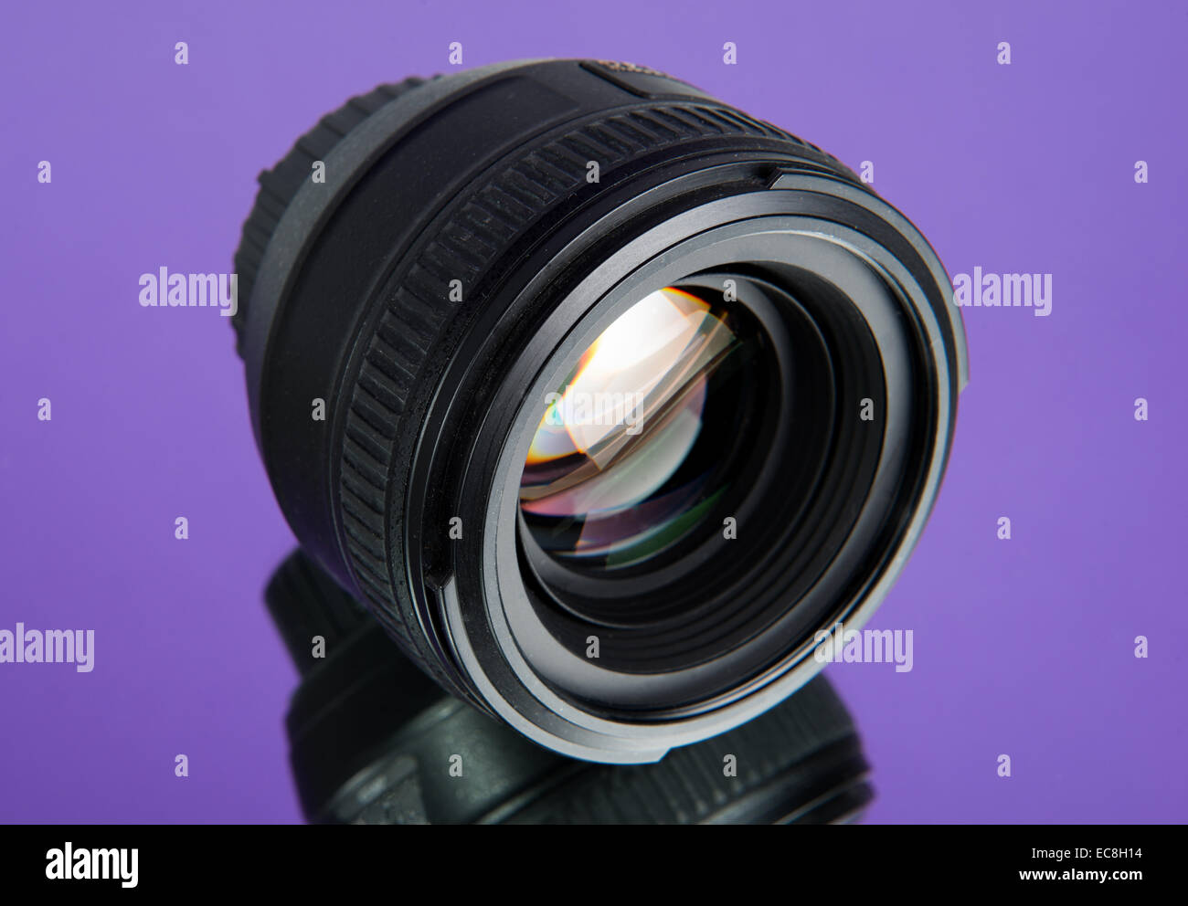 photographic lens with a reflection on a purple background Stock Photo ...