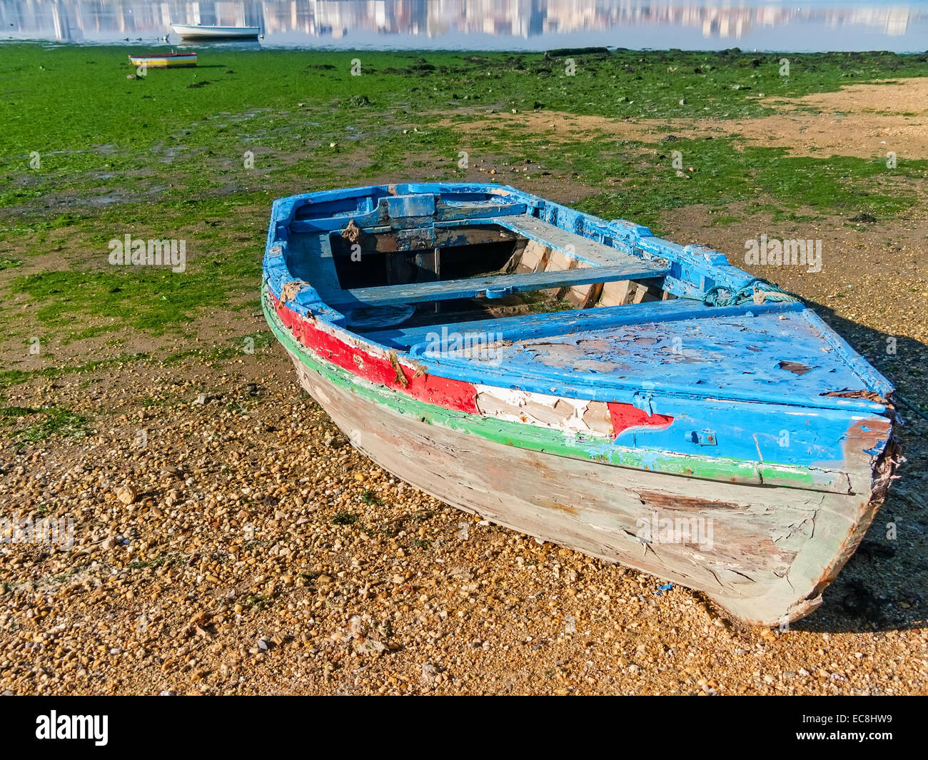 Small, old traditional boat in Seixal, Seixal bay. Portugal Stock Photo ...