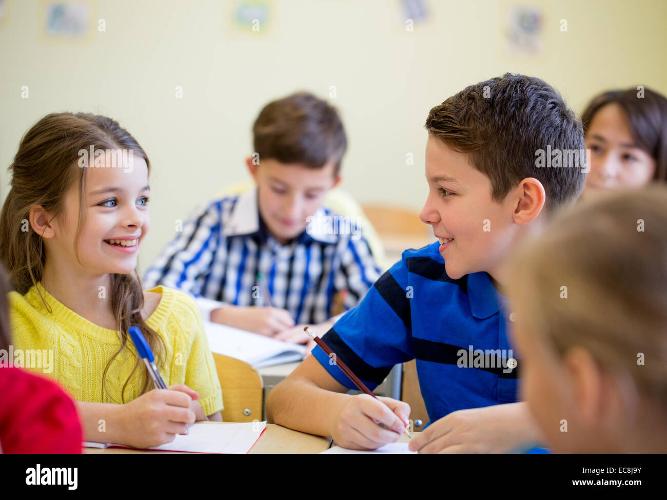 group of school kids writing test in classroom Stock Photo - Alamy