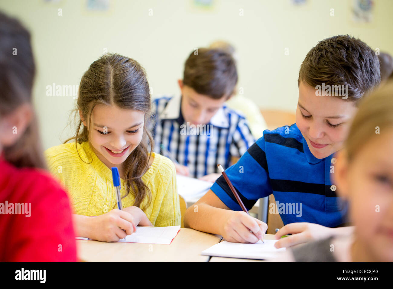 group of school kids writing test in classroom Stock Photo - Alamy
