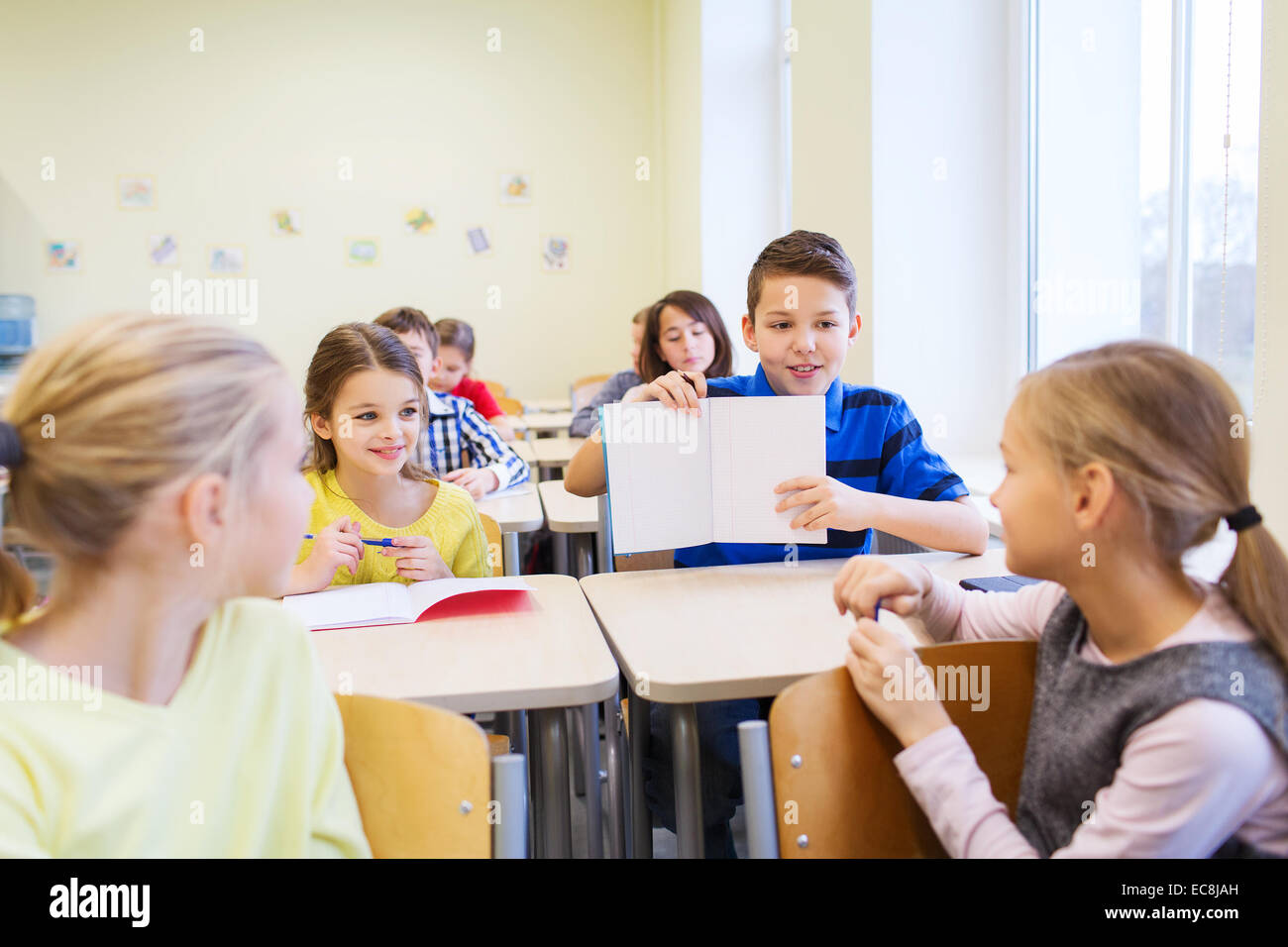 group of school kids writing test in classroom Stock Photo - Alamy