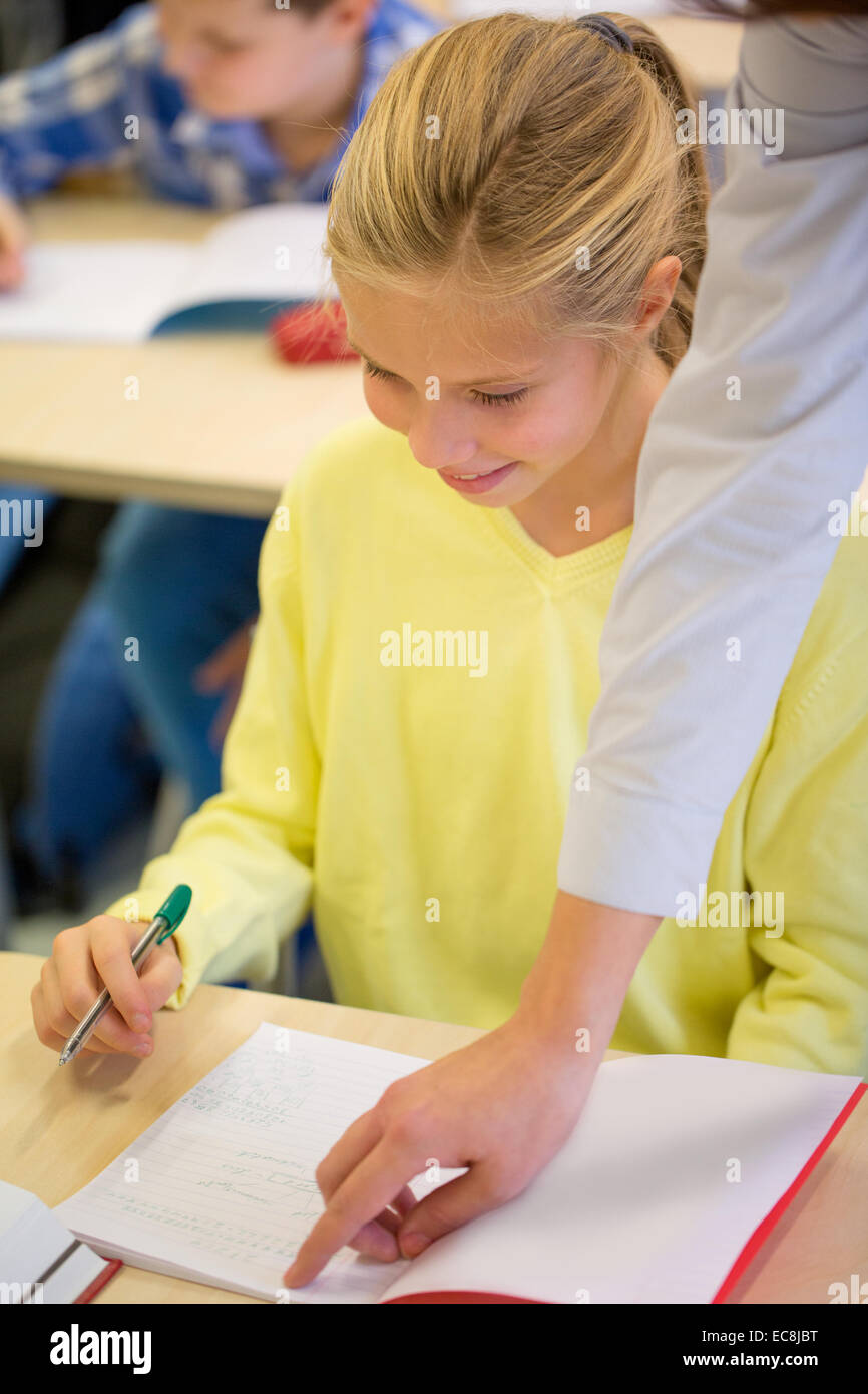 group of school kids writing test in classroom Stock Photo - Alamy