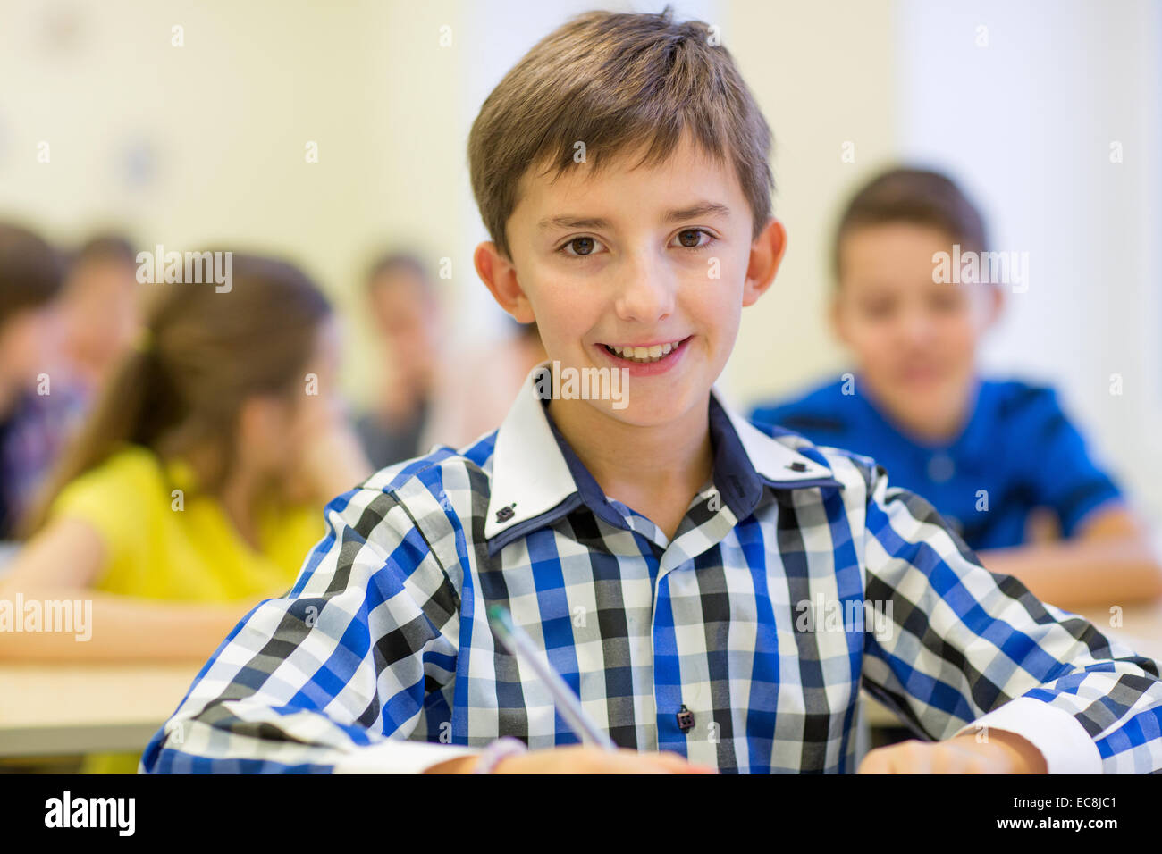 group of school kids writing test in classroom Stock Photo - Alamy