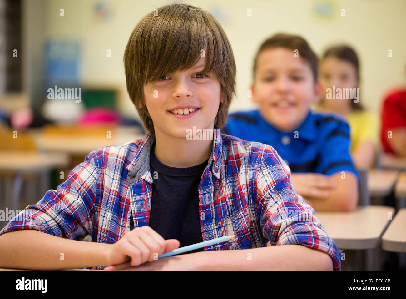group of school kids with notebooks in classroom Stock Photo - Alamy