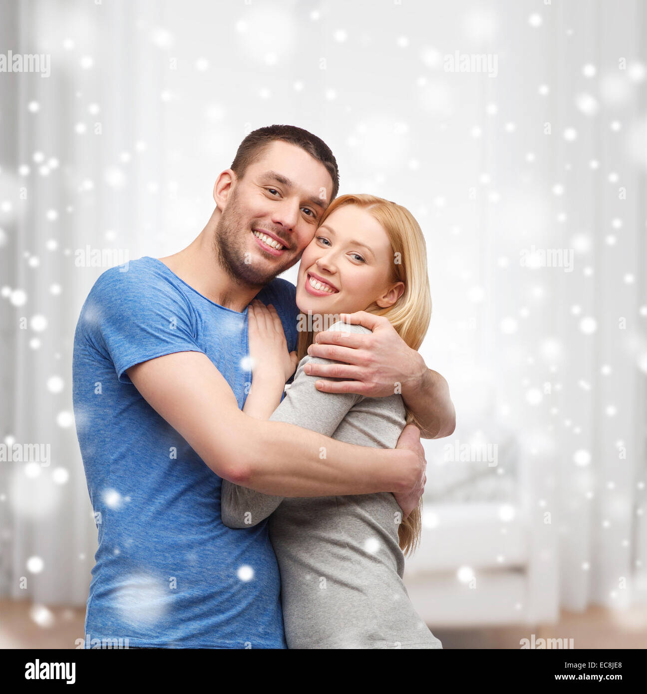 Home happy couple man woman hugging hi-res stock photography and images ...