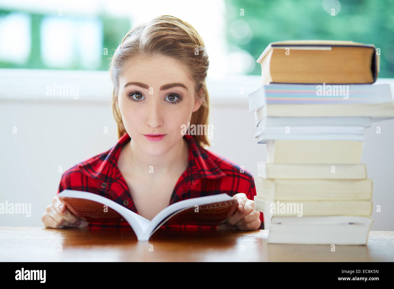 Girl reading books Stock Photo - Alamy