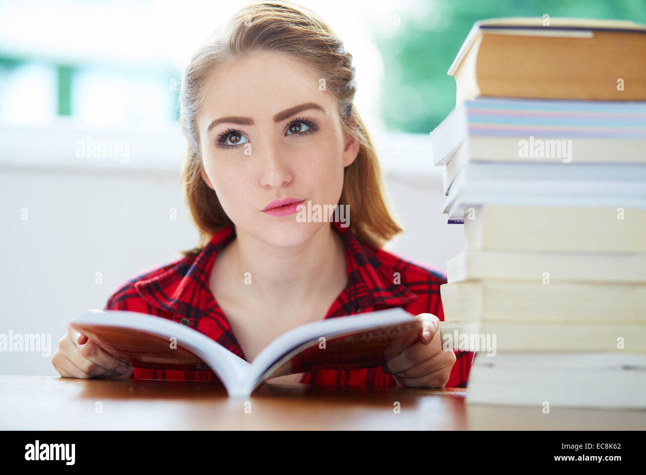 Girl reading books Stock Photo - Alamy
