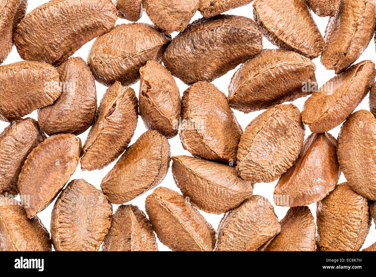 Brazilian nuts in shells against white background Stock Photo - Alamy
