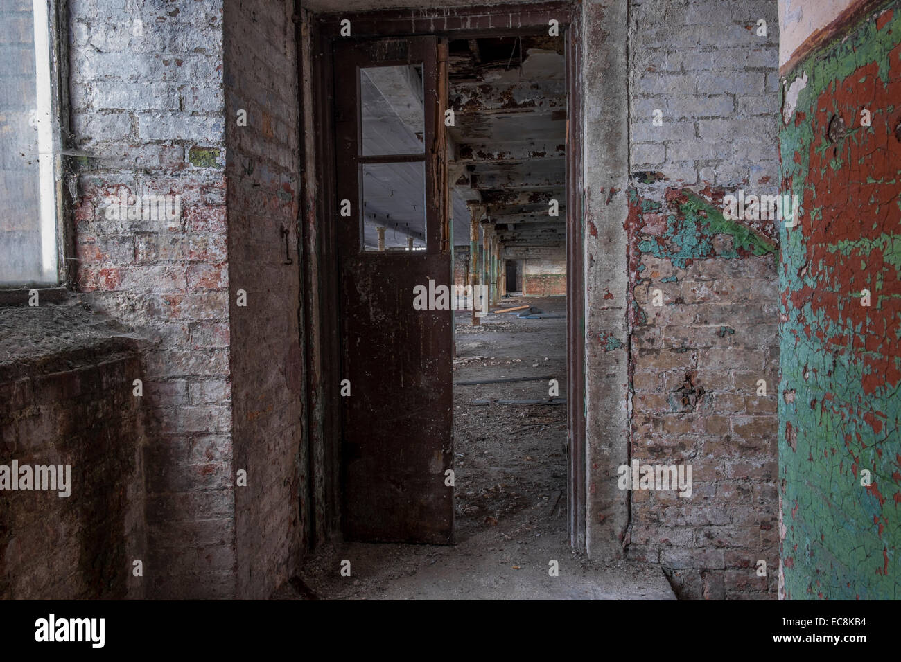 Disused old Lancashire cotton mill in a state of decay with a lot of ...