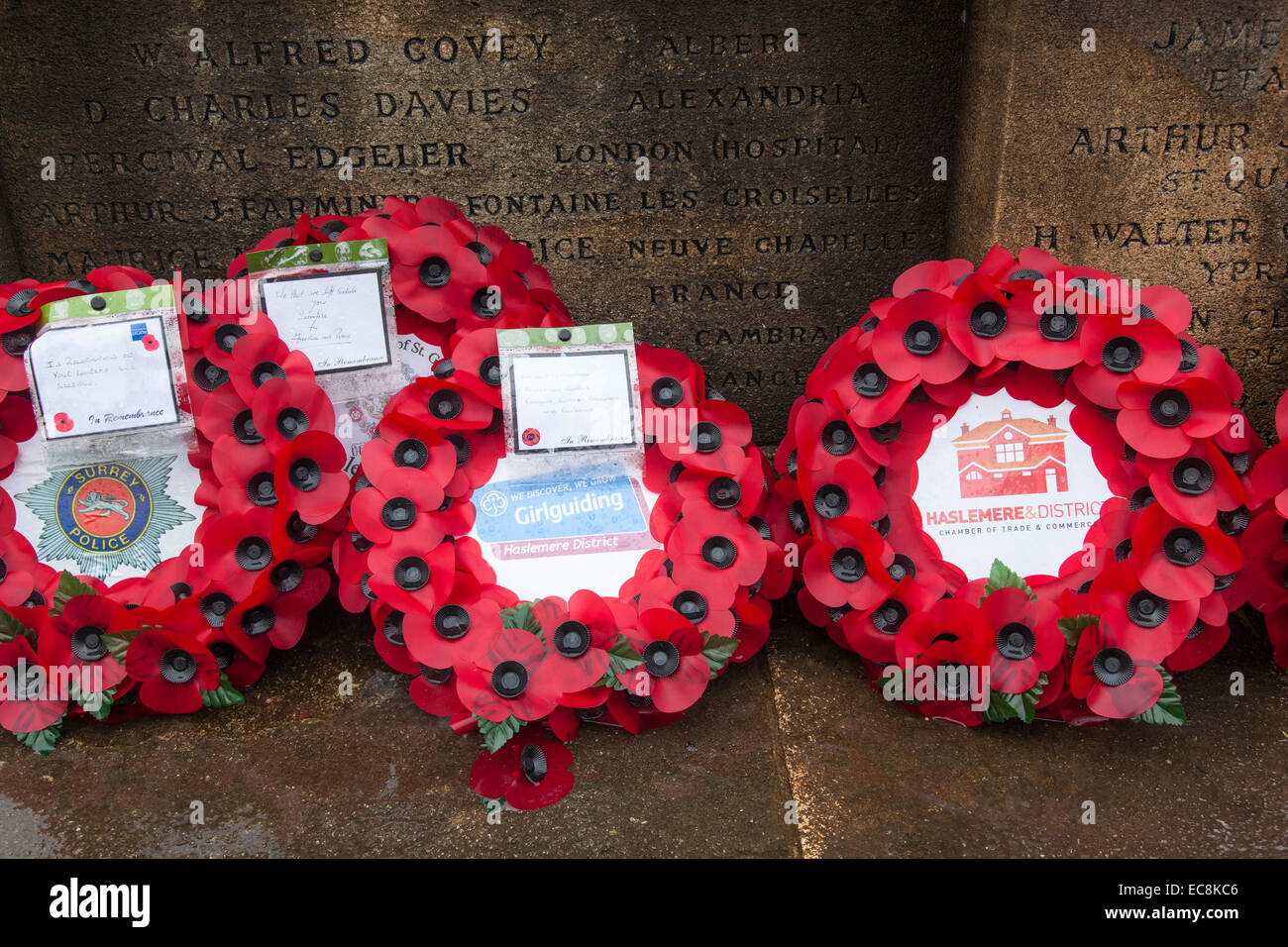 Poppy wreaths laid against the base of a war memorial Stock Photo - Alamy