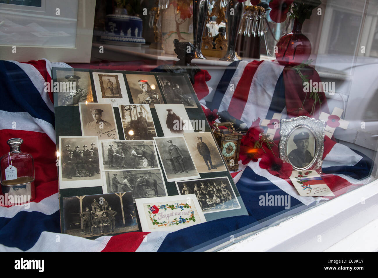 Photographs in a shop window depicting scenes related to WWI to ...