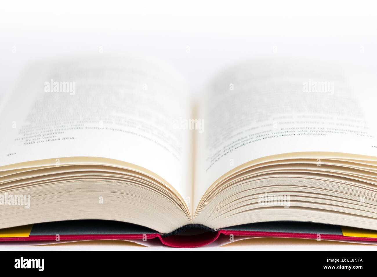 Closeup of a hardcover book open in the middle, isolated on white ...