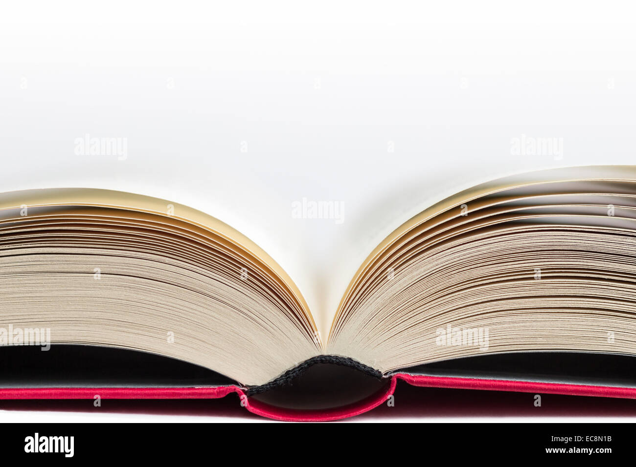 Closeup of a hardcover book open in the middle, isolated on white ...