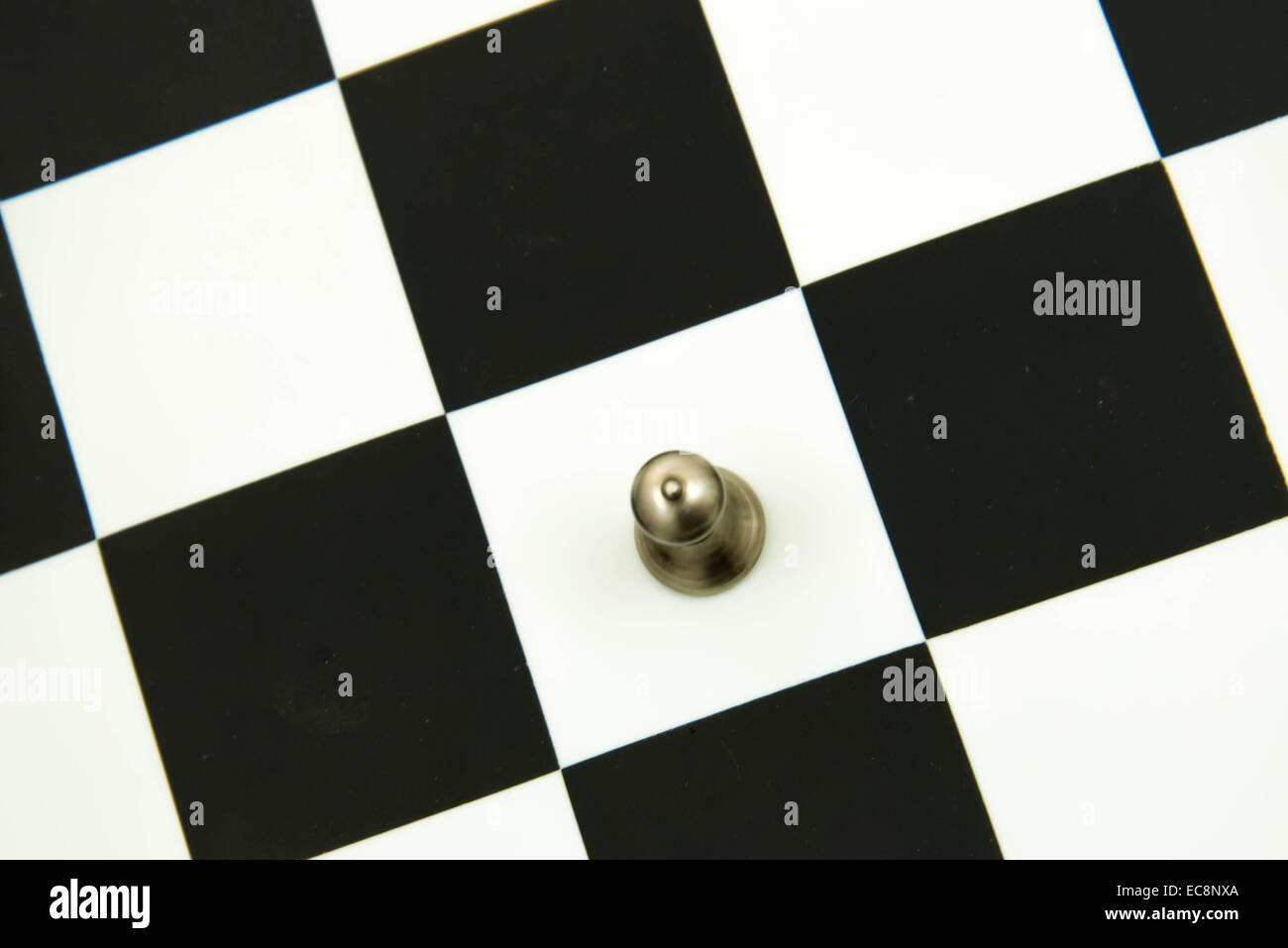 Classic chess game - pawn alone in front on chessboard Stock Photo - Alamy