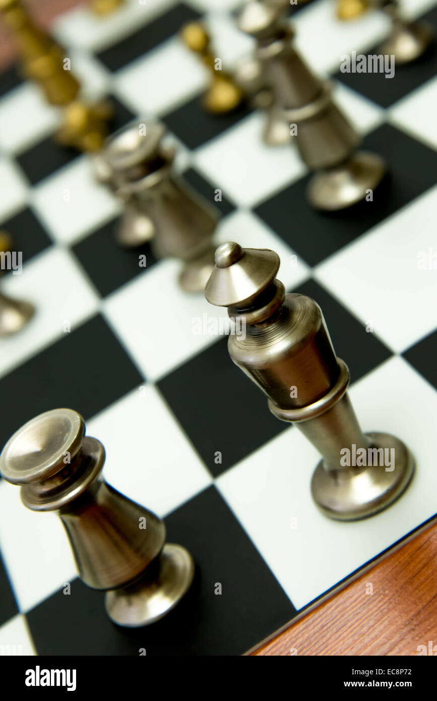 Classic chess game - pieces in play on chessboard Stock Photo - Alamy