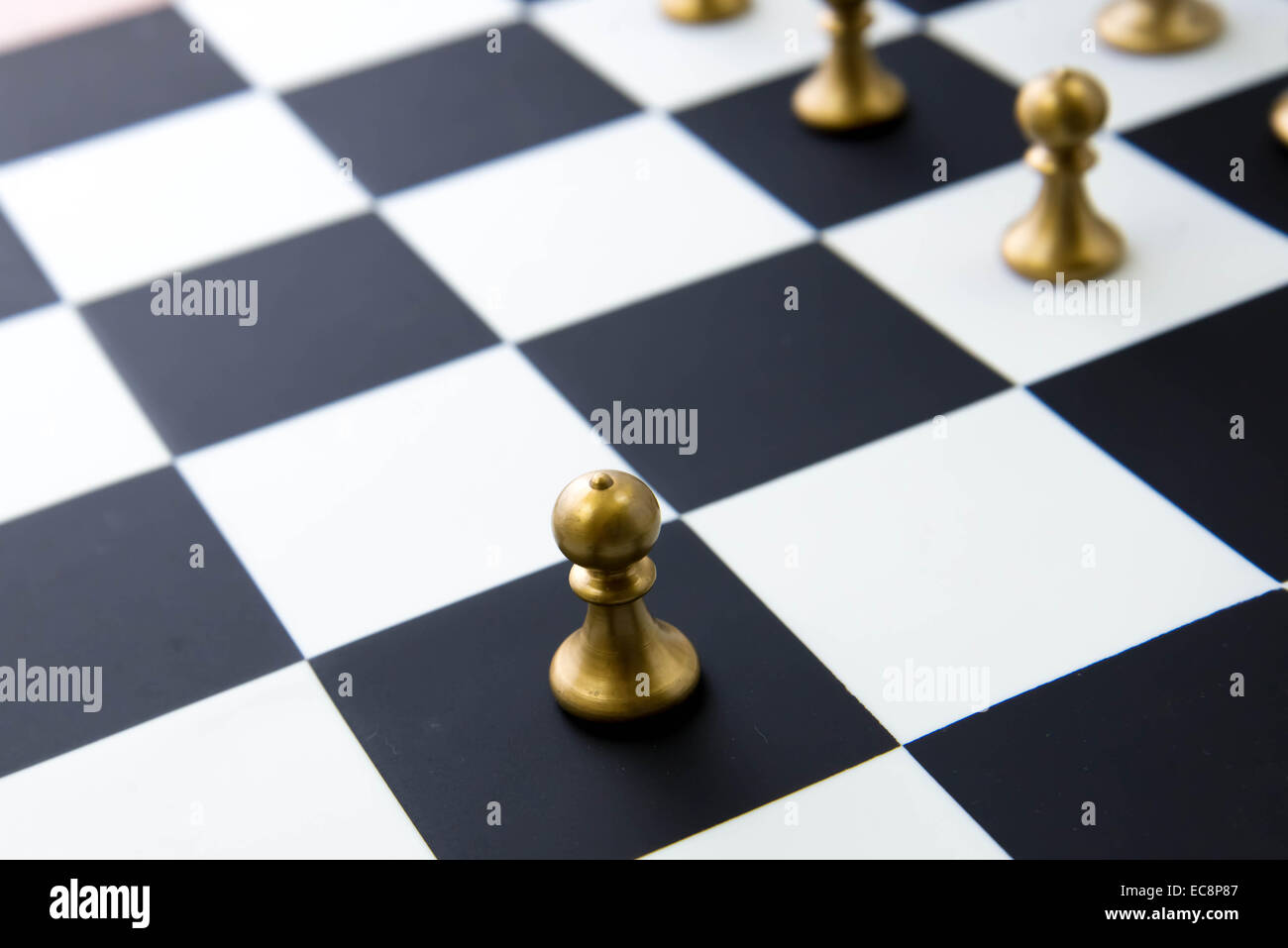Classic chess game - pawn alone in front on chessboard Stock Photo - Alamy