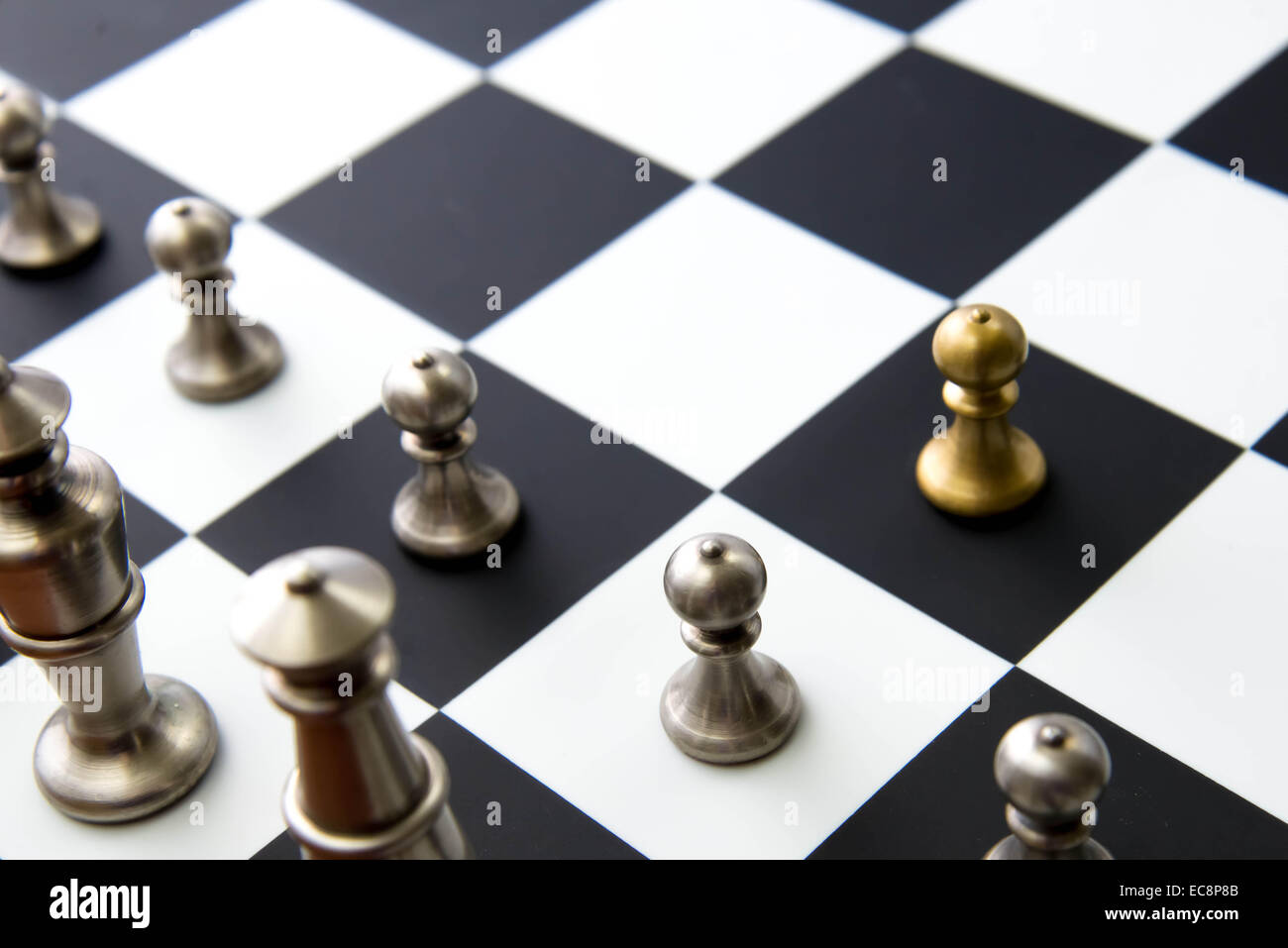 Classic chess game - pawn alone in front on chessboard Stock Photo - Alamy