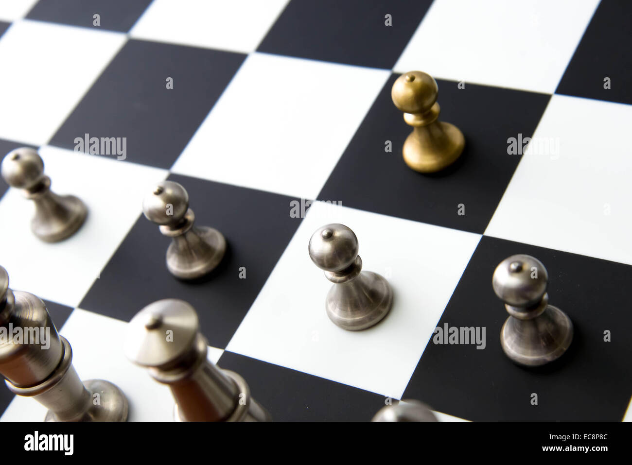 Classic chess game - pawn alone in front on chessboard Stock Photo - Alamy