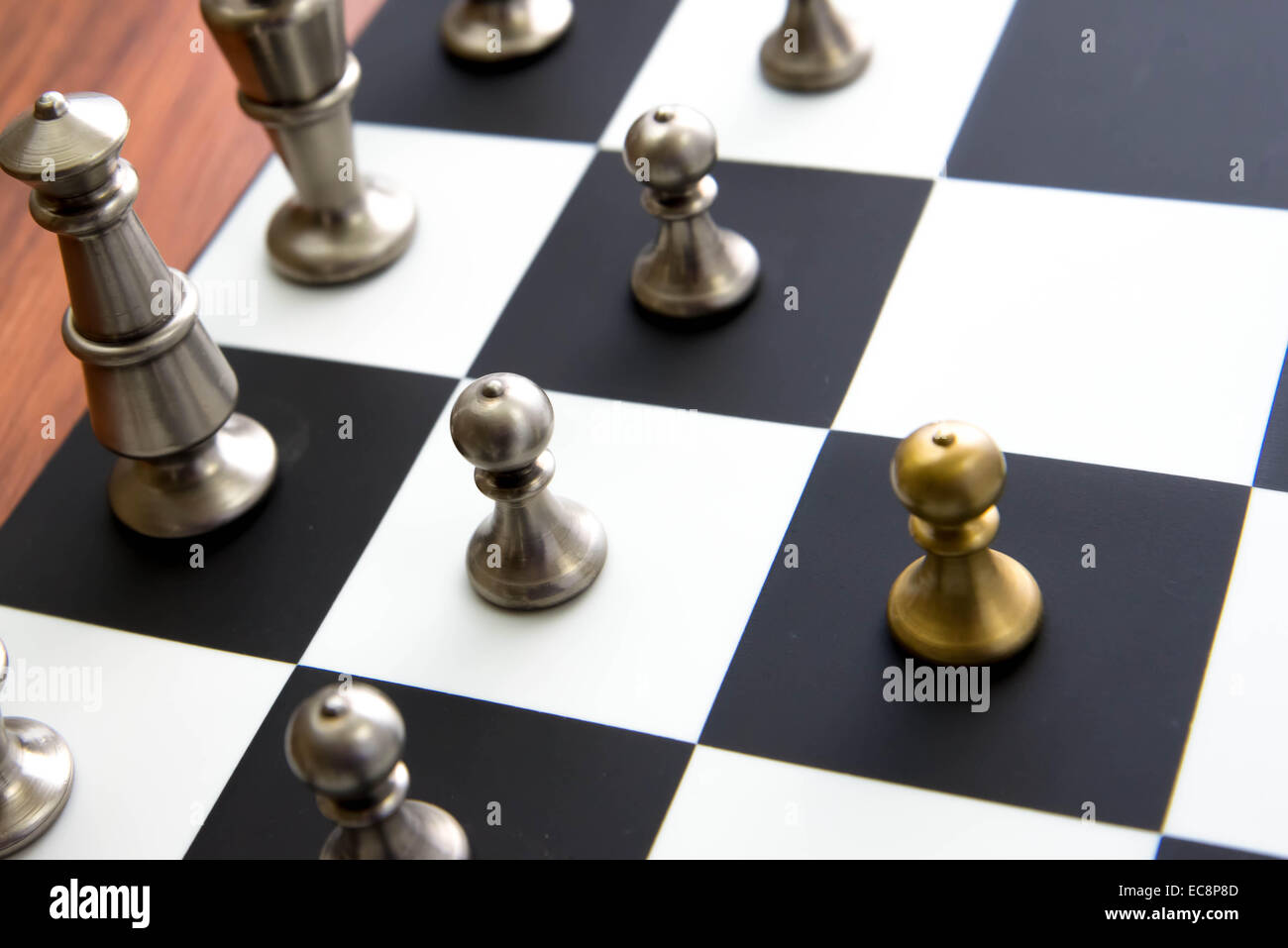 Classic chess game - pawn alone in front on chessboard Stock Photo - Alamy
