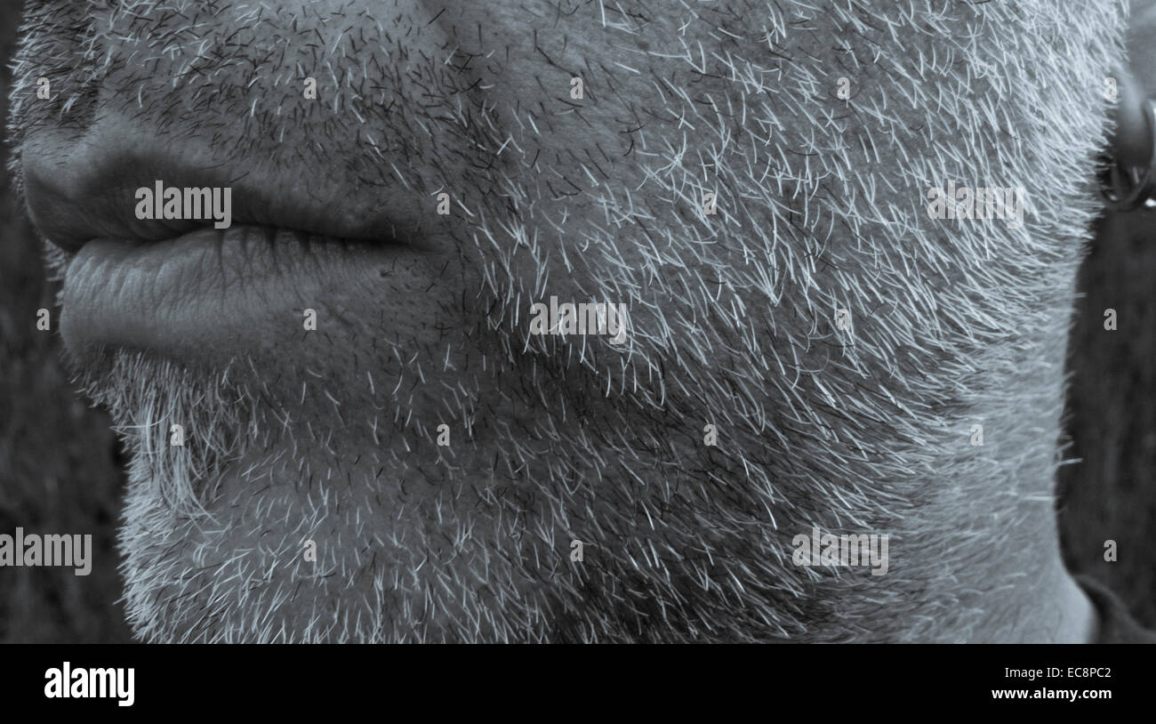 unshaved man's face closeup Stock Photo - Alamy