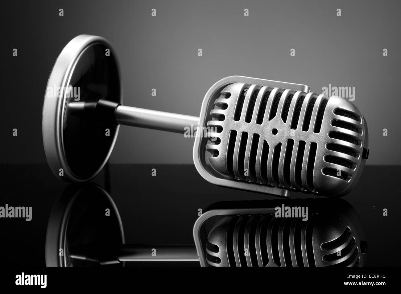 Retro microphone on grey Stock Photo - Alamy