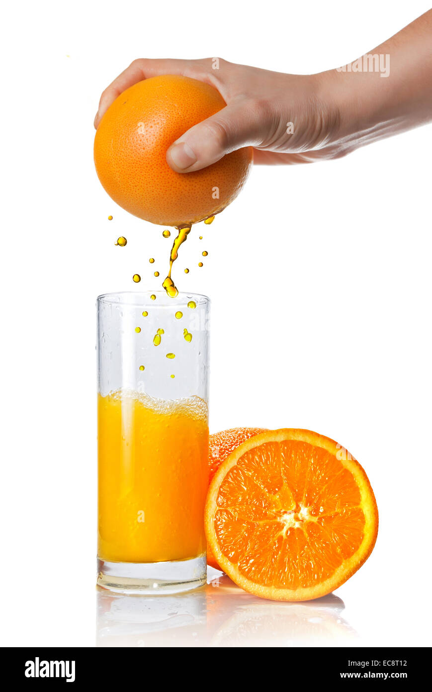 Hand squeezing half orange glass hi-res stock photography and images ...