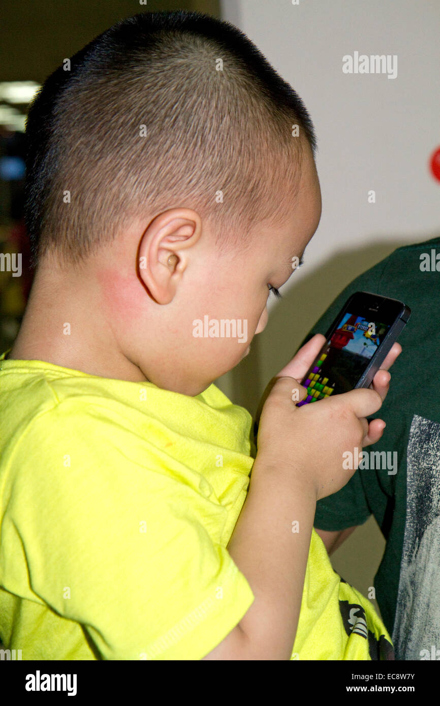 Boy iphone playing game hi-res stock photography and images - Alamy