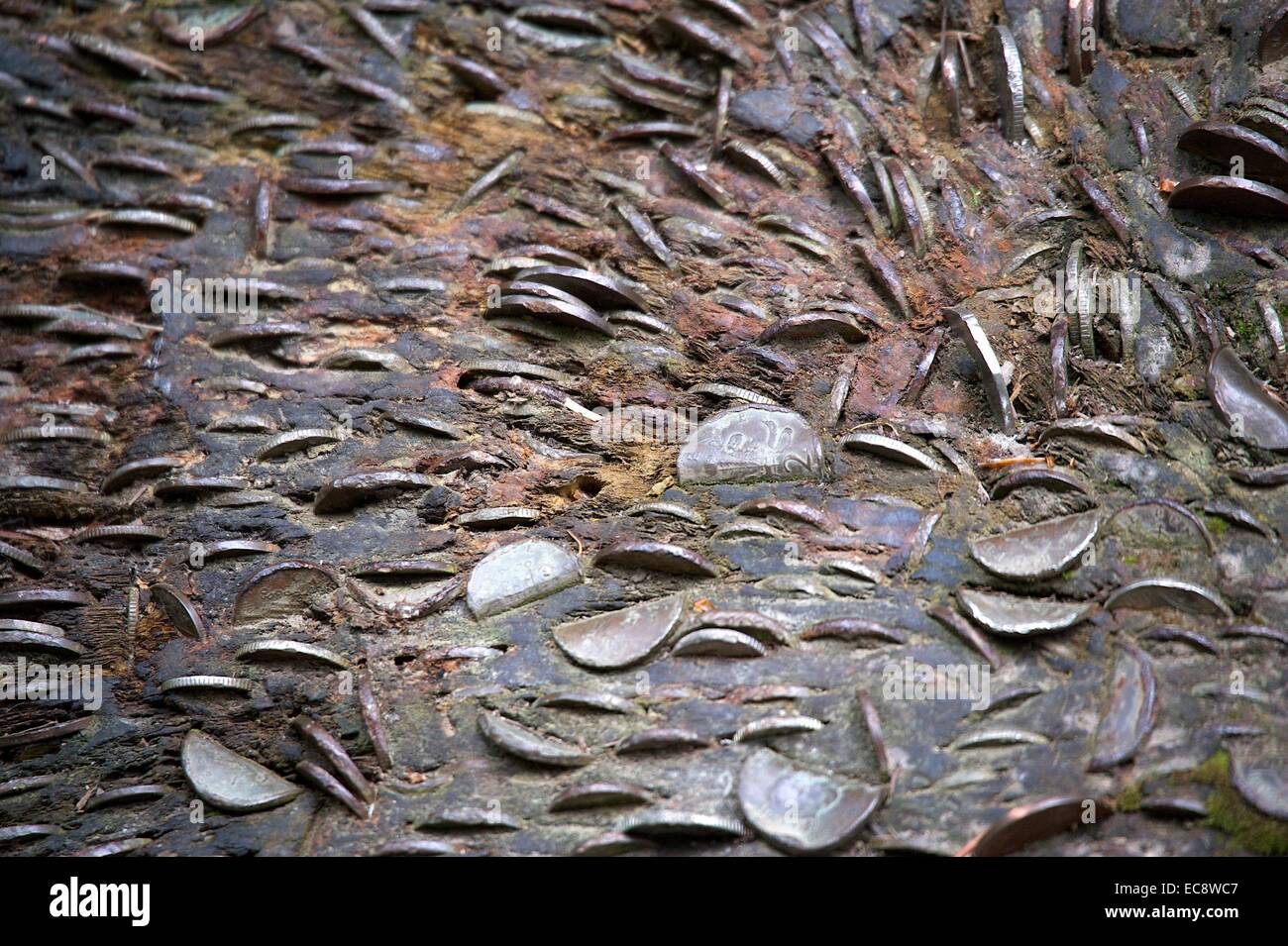 A collection of british coins embedded into stone Stock Photo - Alamy